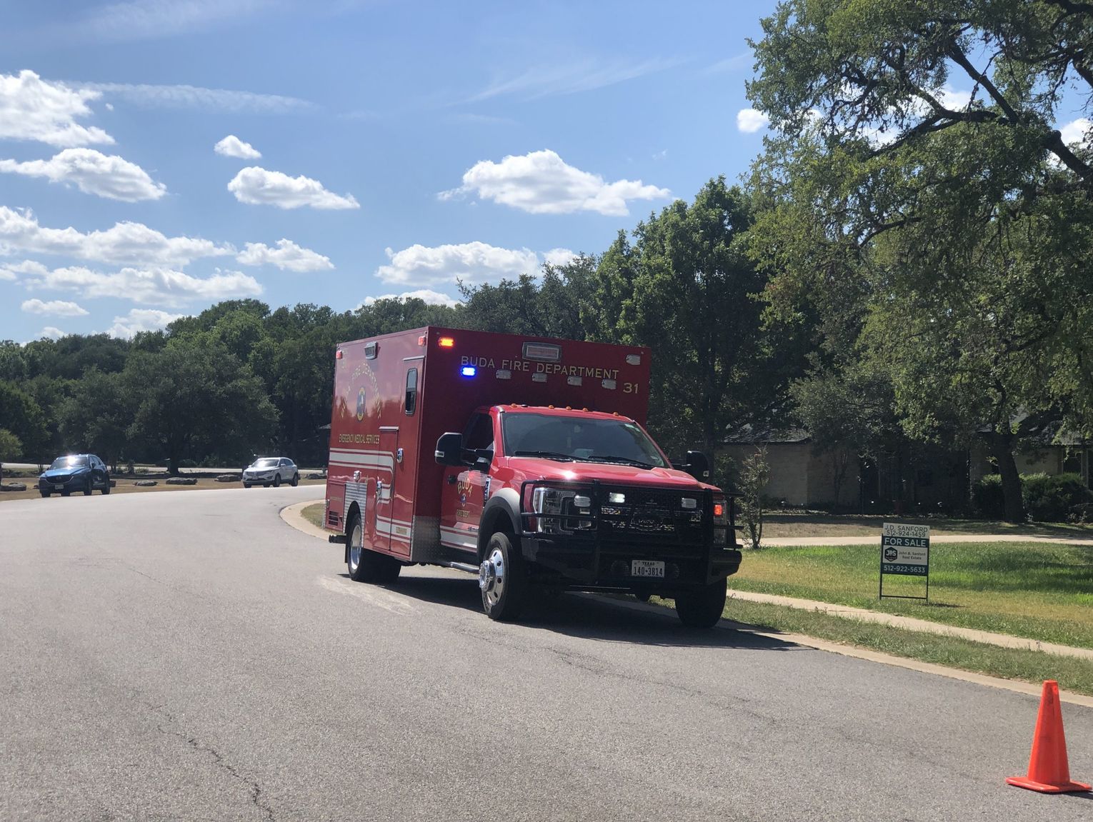 UPDATED: Crews fight grass fire near Buda neighborhood